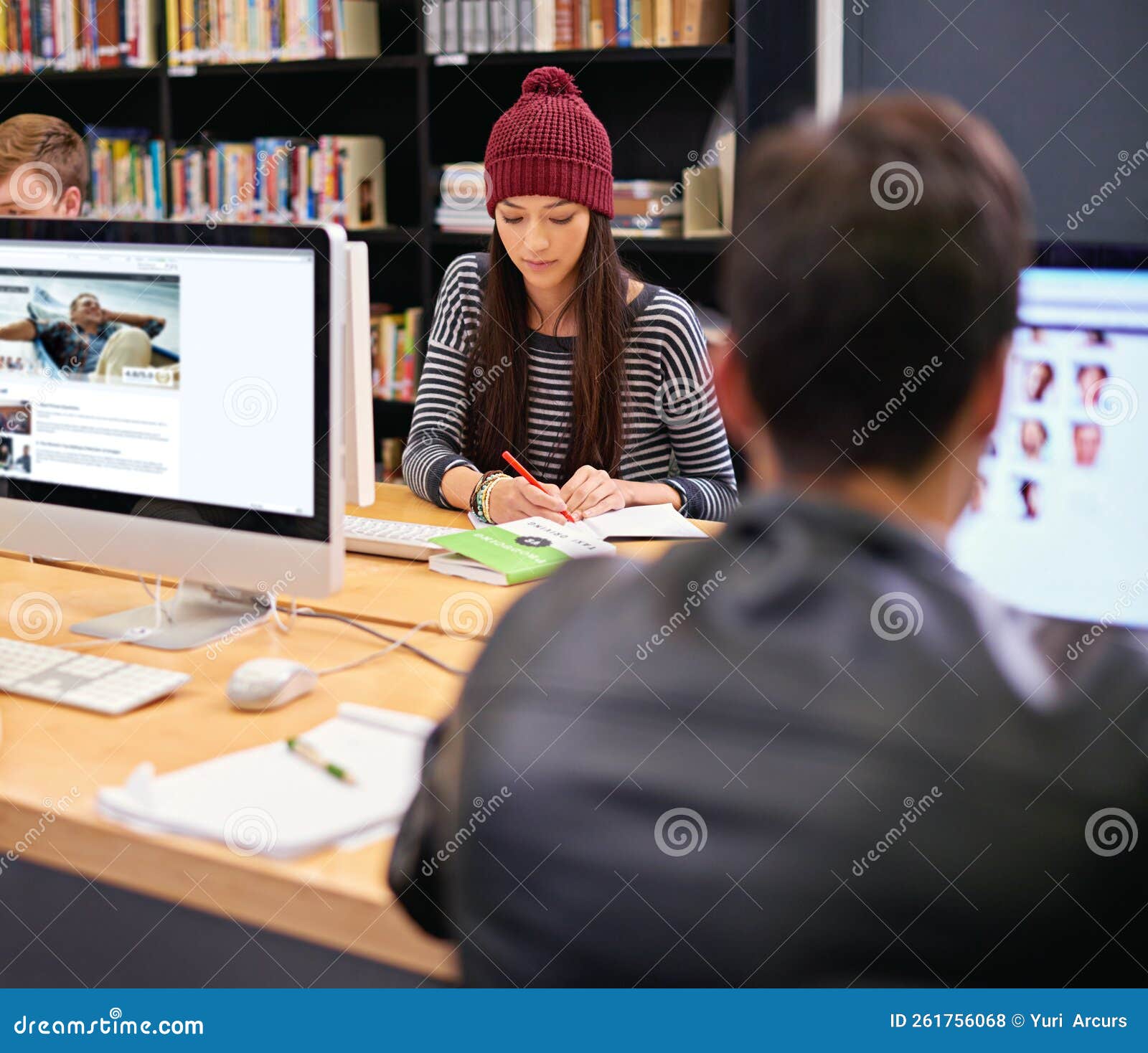 There is always More To Learn. Students Working on Computers in a University Library. Stock ...