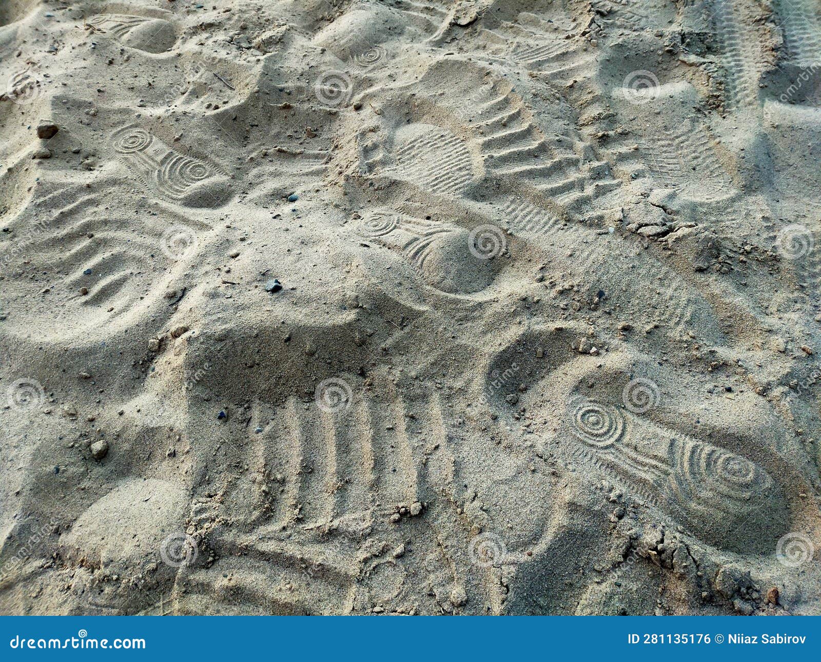 Multiple Footprints In The Sand Desert. Footprints Are Of Shoes, Boots ...