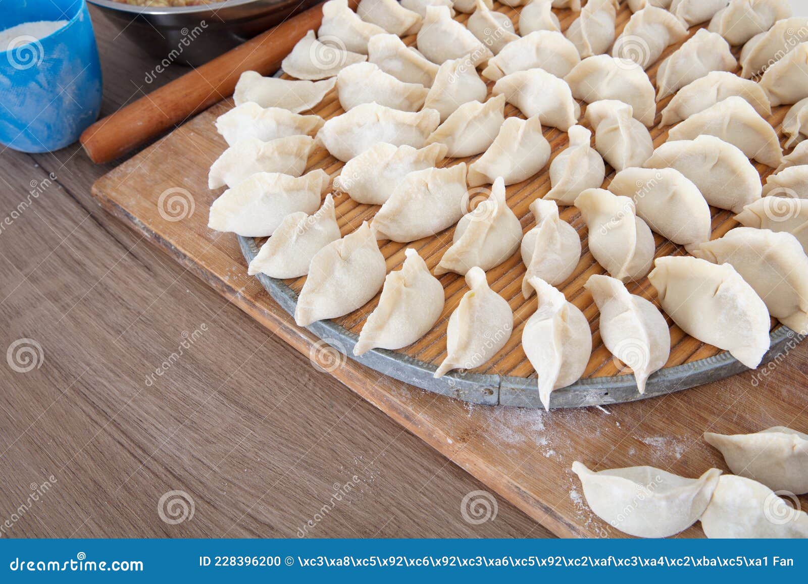 There are Neatly Wrapped Dumplings on a Circular Tray in the Kitchen ...