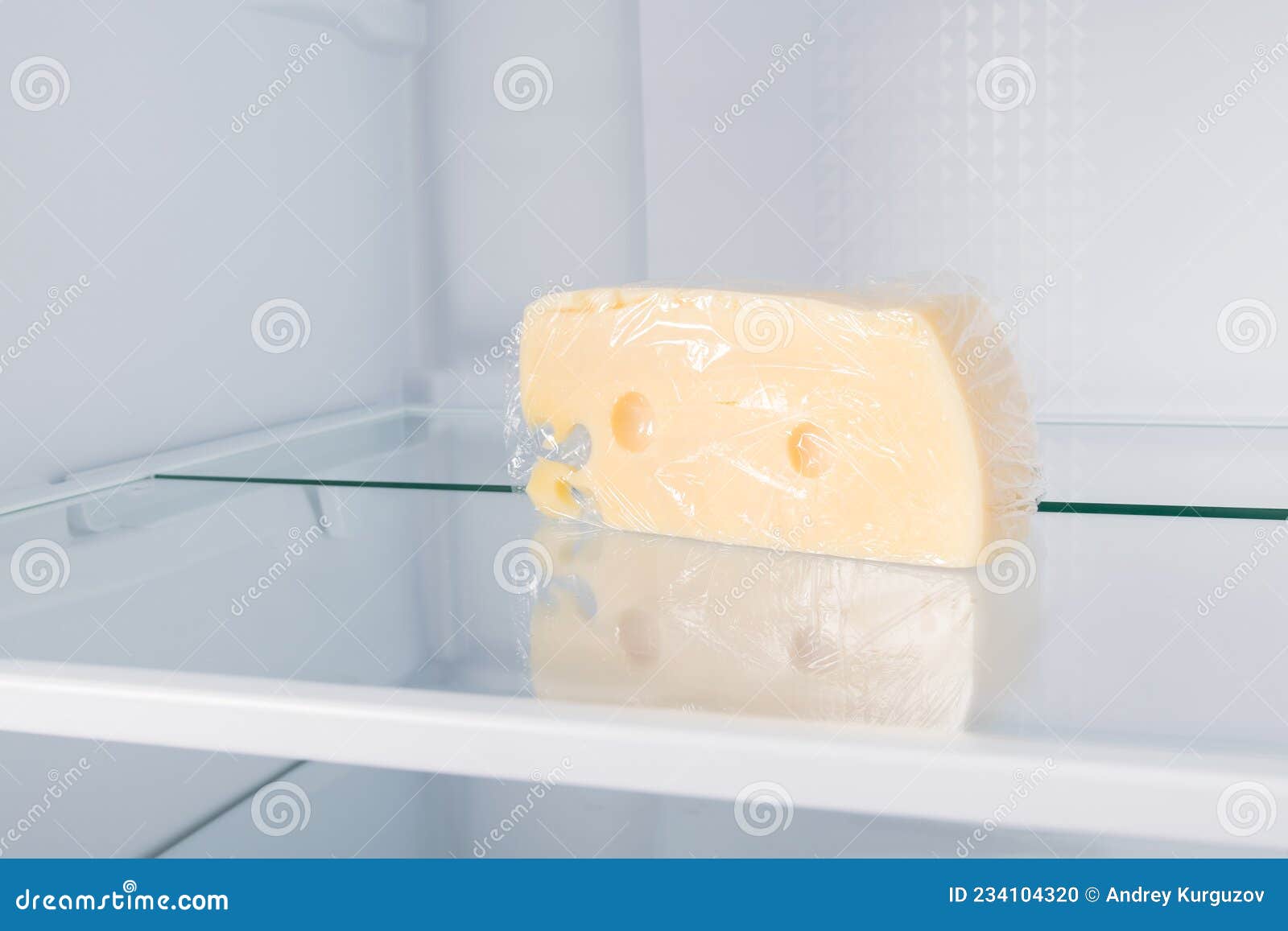 There is a Piece of Cheese on the Shelf in an Empty Refrigerator Stock ...