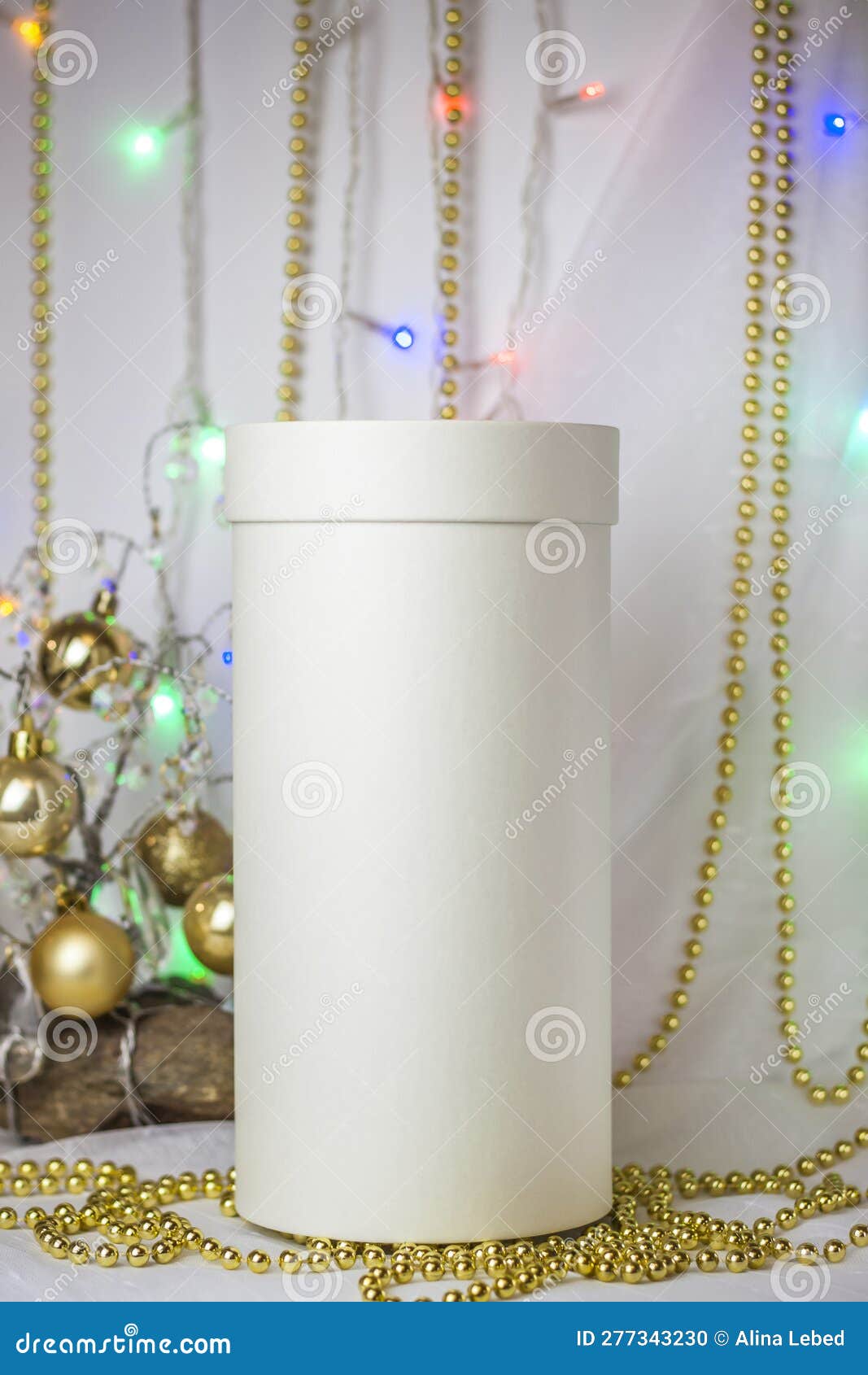 There is a Round Box on the Table. the Surface is Empty for Writing or ...