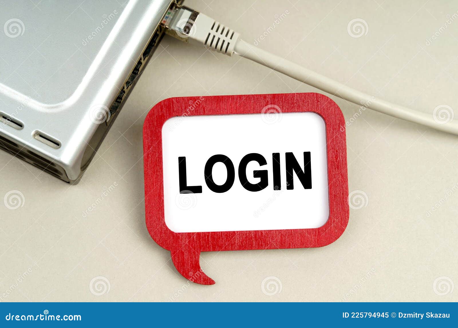 There is a Router Connected To the Network on the Table, Next To a Sign ...