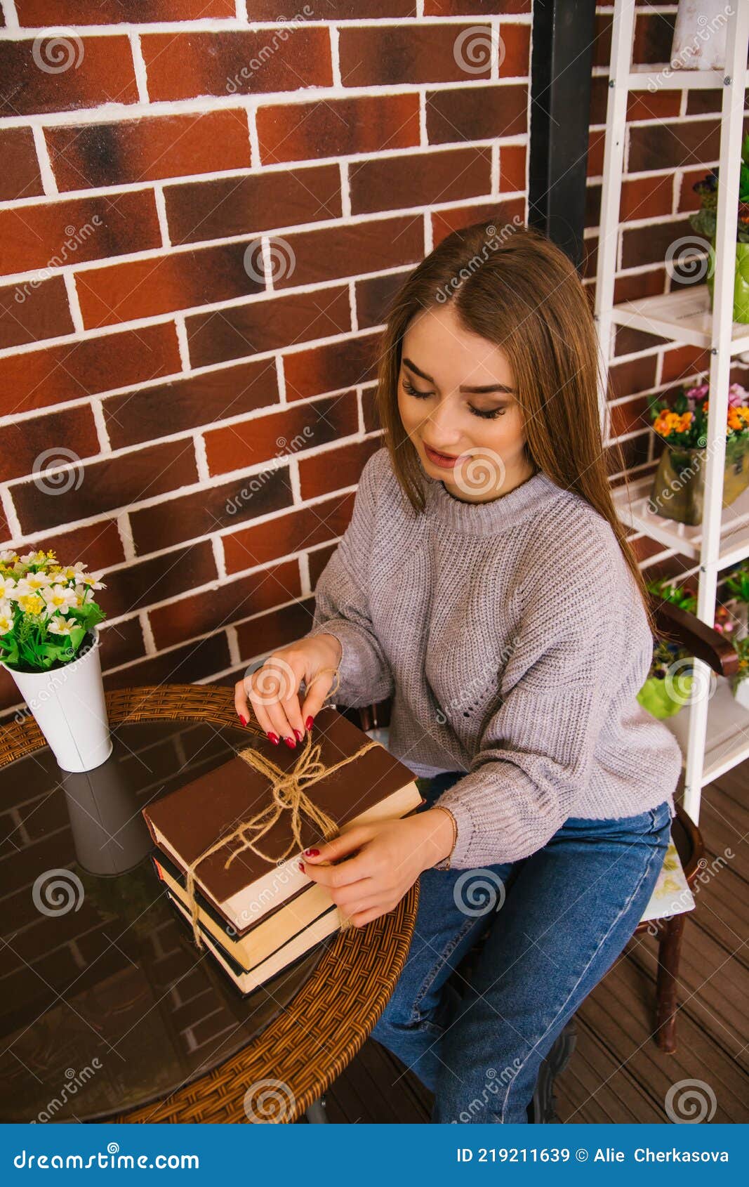 There`s a Stack of Books on the Table.the Books are Tied with String ...