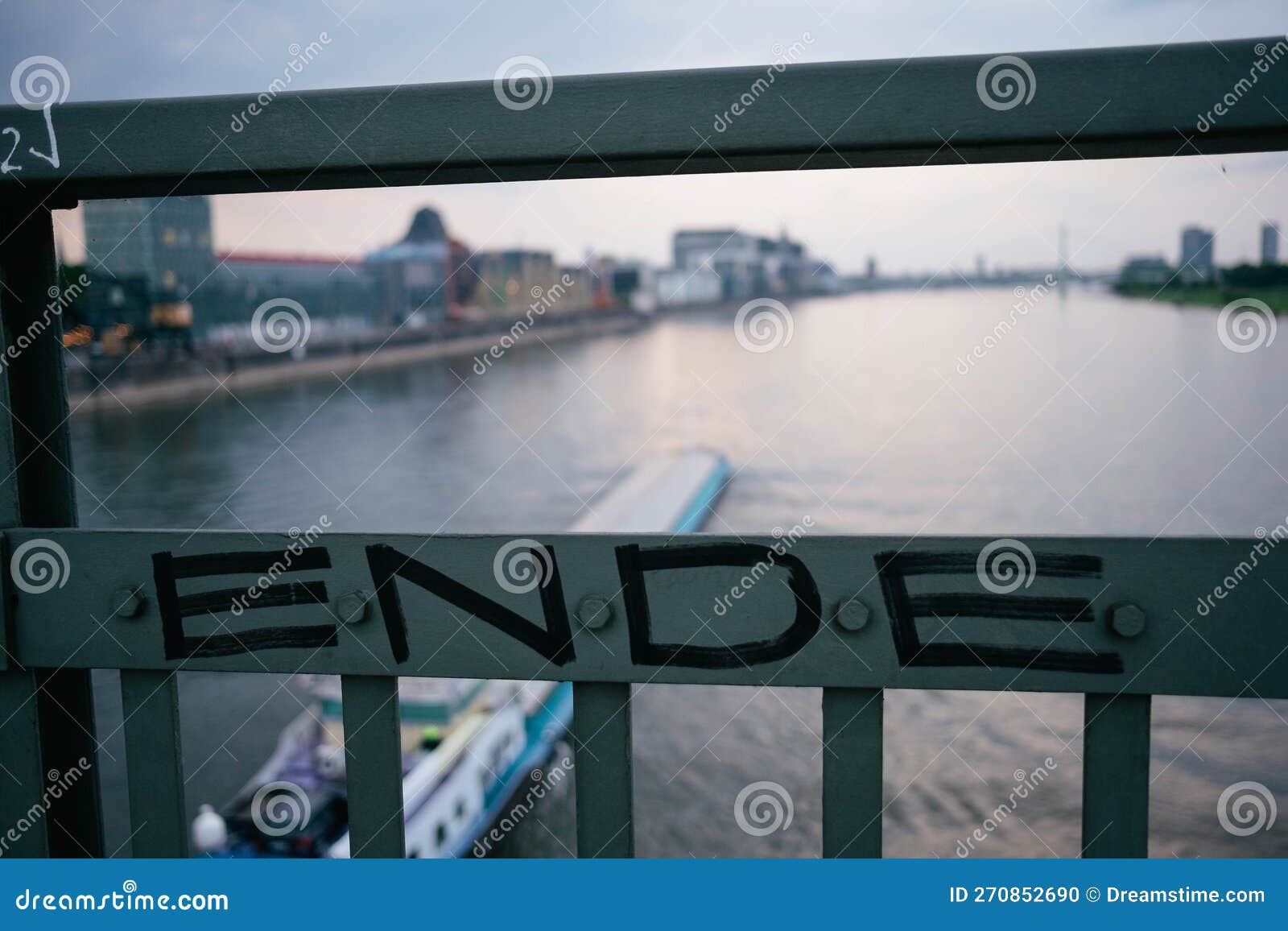 The Word Ende is Written on the Railing. in the Background is a Ship on ...