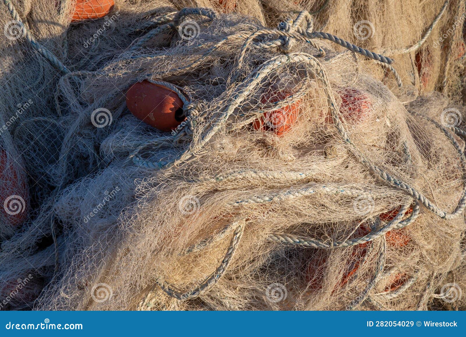 There is Some Net Sitting in the Sand on Top of it Stock Image - Image ...