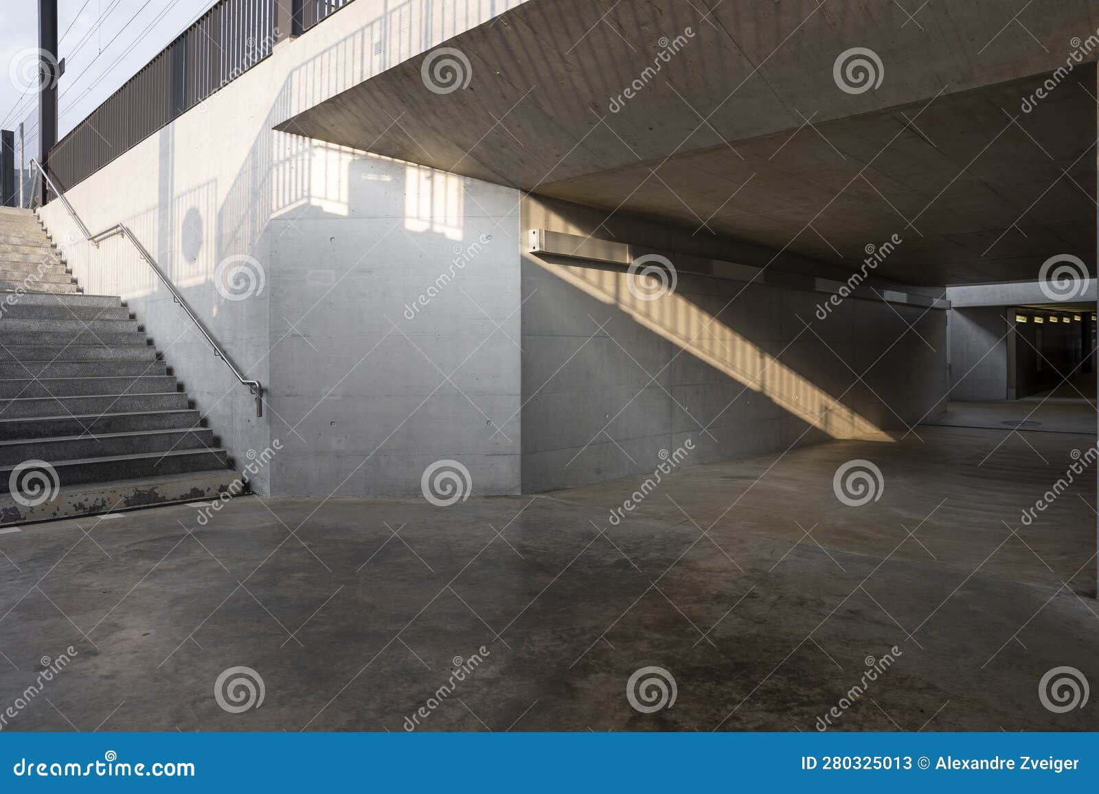 There is a Stairway with a Long Pedestrian Underpass at the Station ...