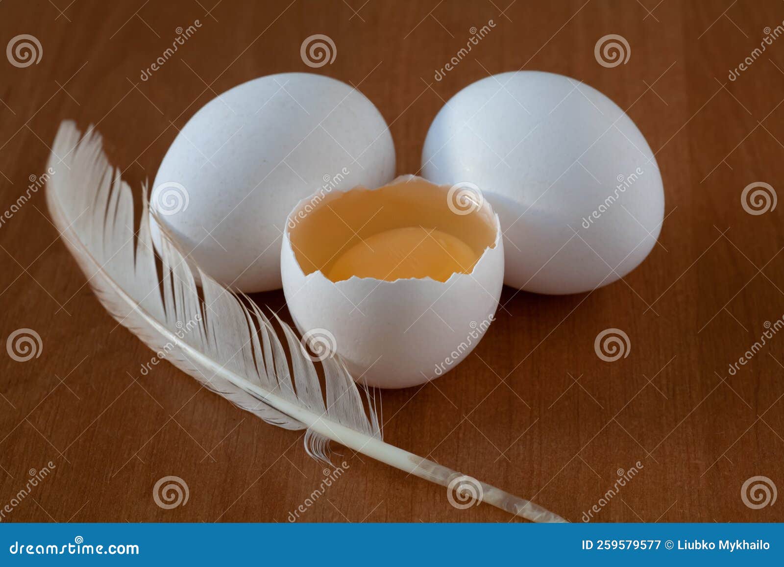 There are Three White Eggs on the Table. One of Them is Broken Stock ...