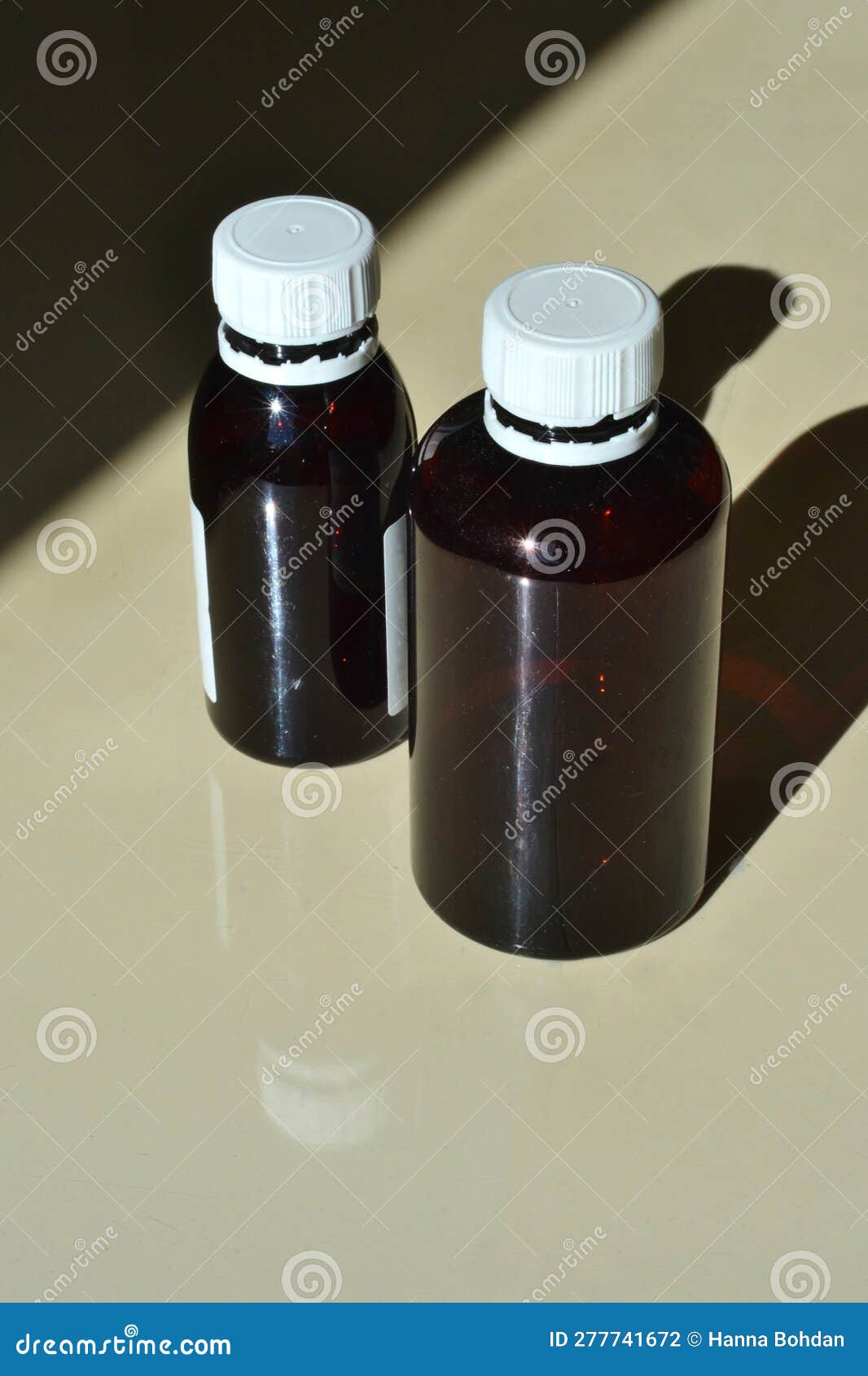 There are Two Bottles of Syrup on the Table Stock Photo - Image of ...