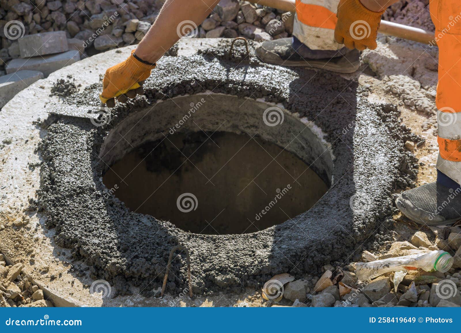 There is a Utility Worker Who is Constructing a Pit for a Septic Tank ...