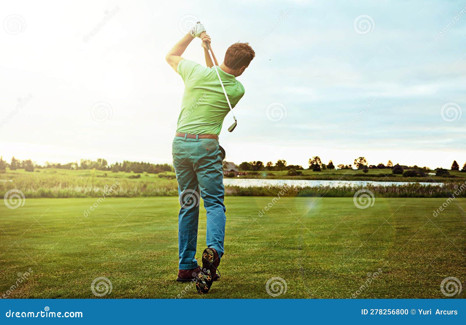 Theres Power in His Swing. a Man Practicing His Swing on the Golf ...