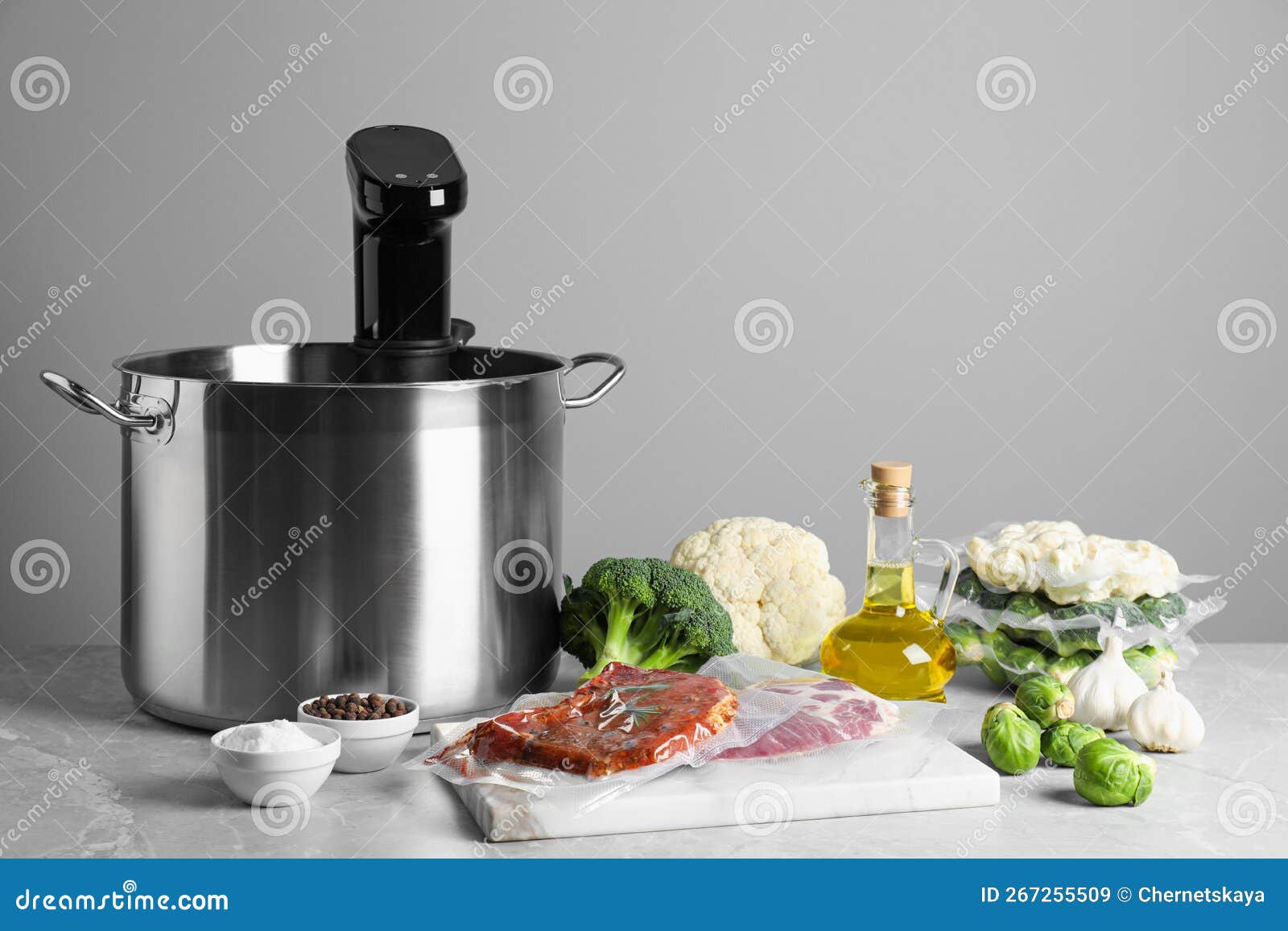 Thermal Immersion Circulator in Pot and Ingredients on Light Grey Table ...