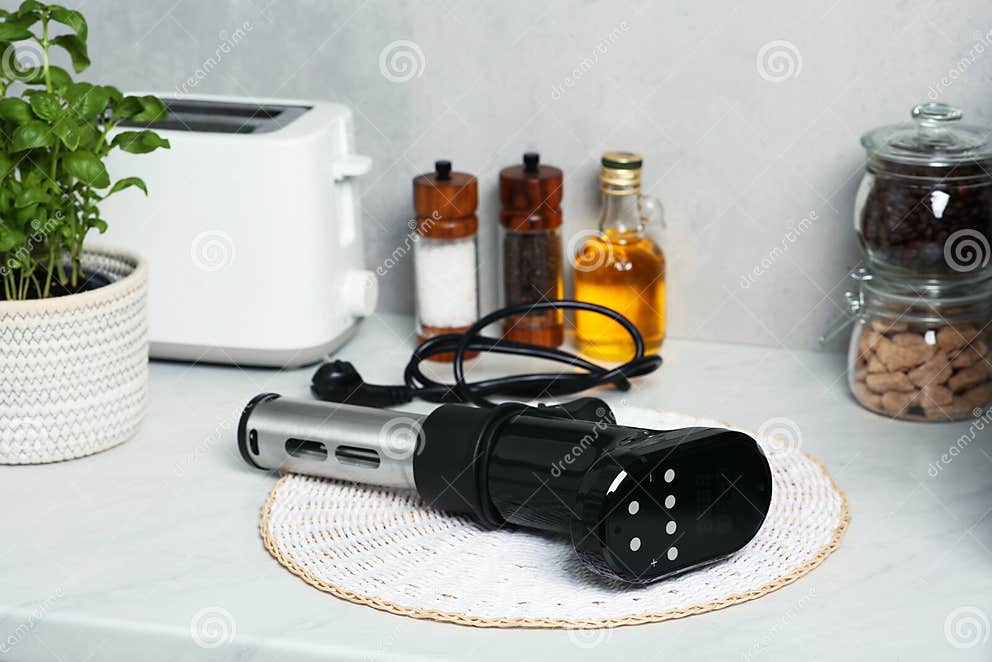 Thermal Immersion Circulator on Table in Kitchen. Sous Vide Cooking ...