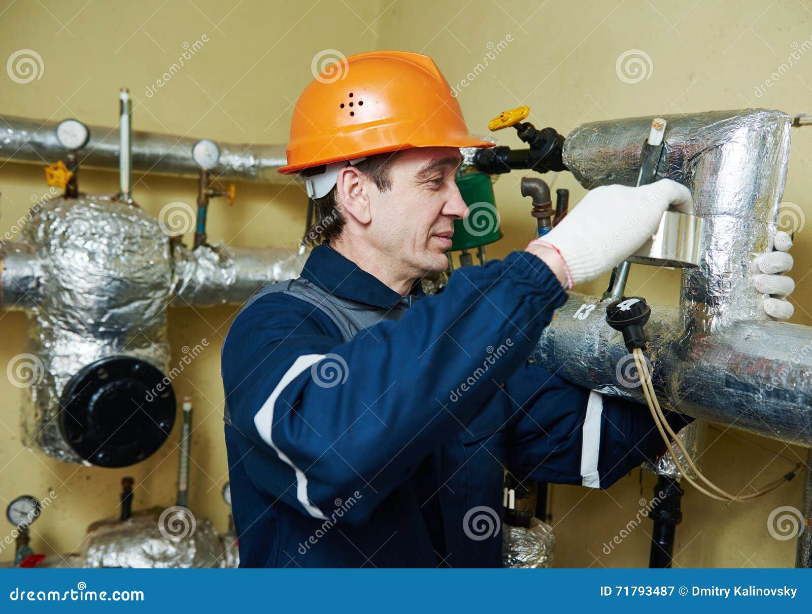 Thermal Insulation. Worker Insulating Heating System Pipes with Foil ...