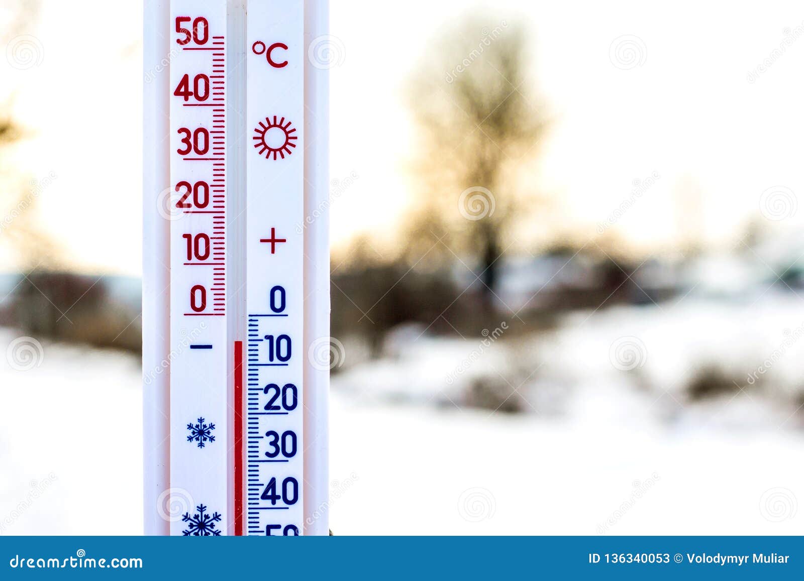 The Thermometer on the Blurred Background of the Winter Landscape Shows ...