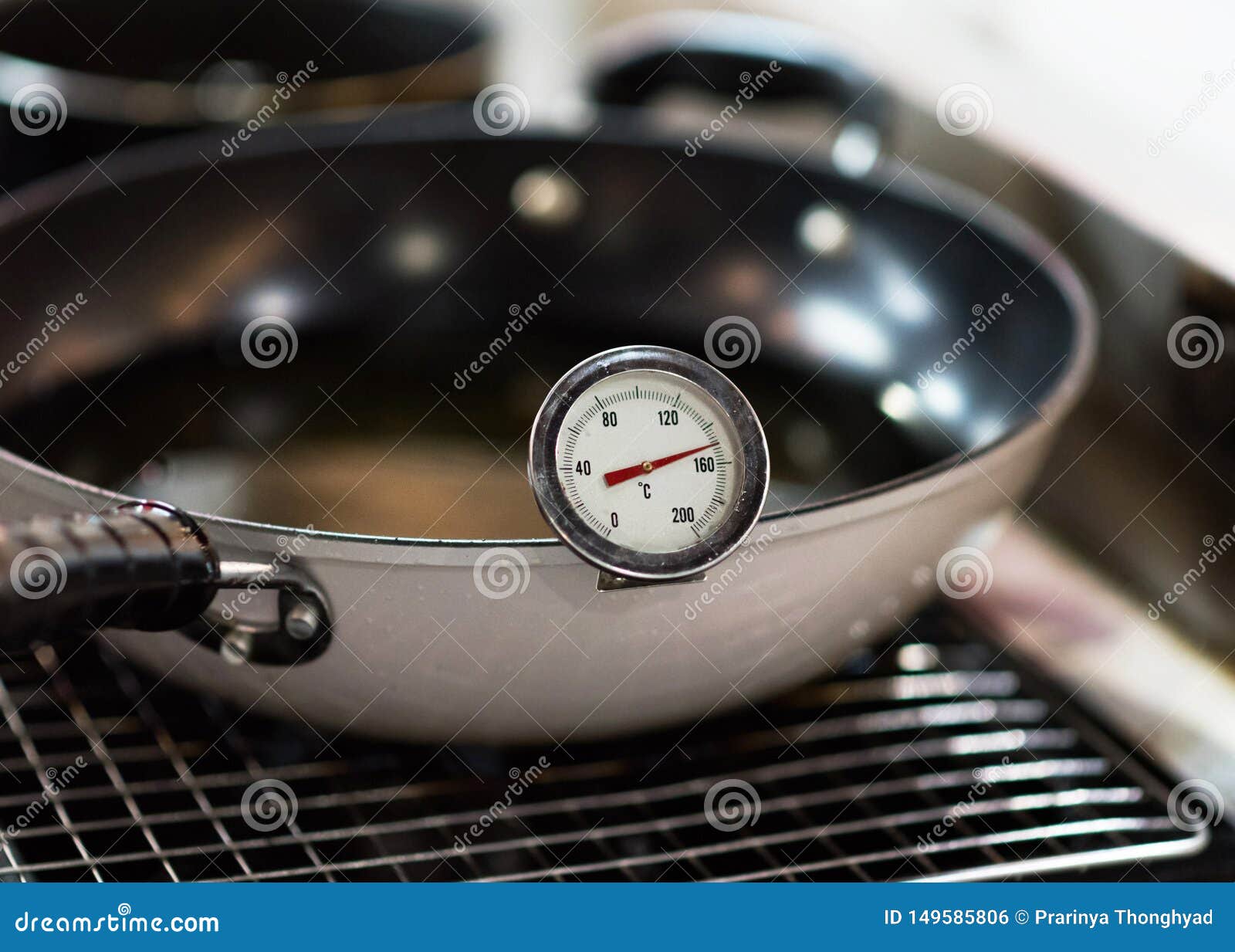 Thermometer for Food, Dial Thermometer in Heating Water Stock Photo ...