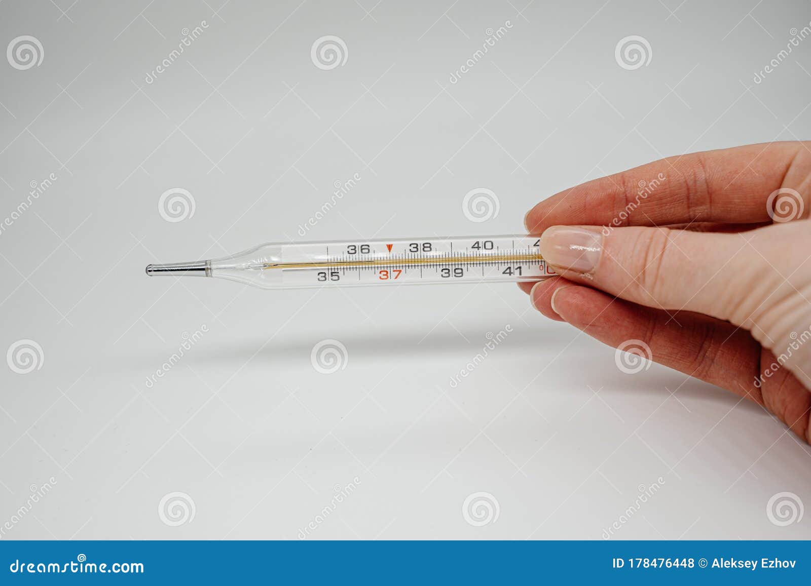 Thermometer in Hand Close-up with a Temperature of 36,5 Stock Photo ...