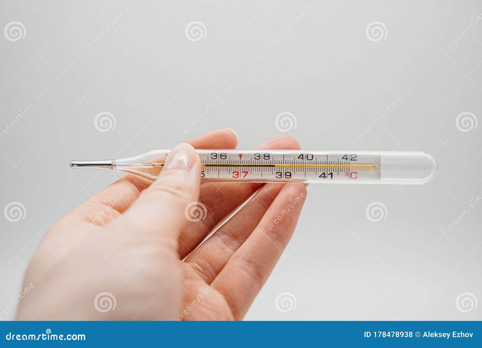 Thermometer in Hand Close-up with a Temperature of 38.6 Stock Photo ...