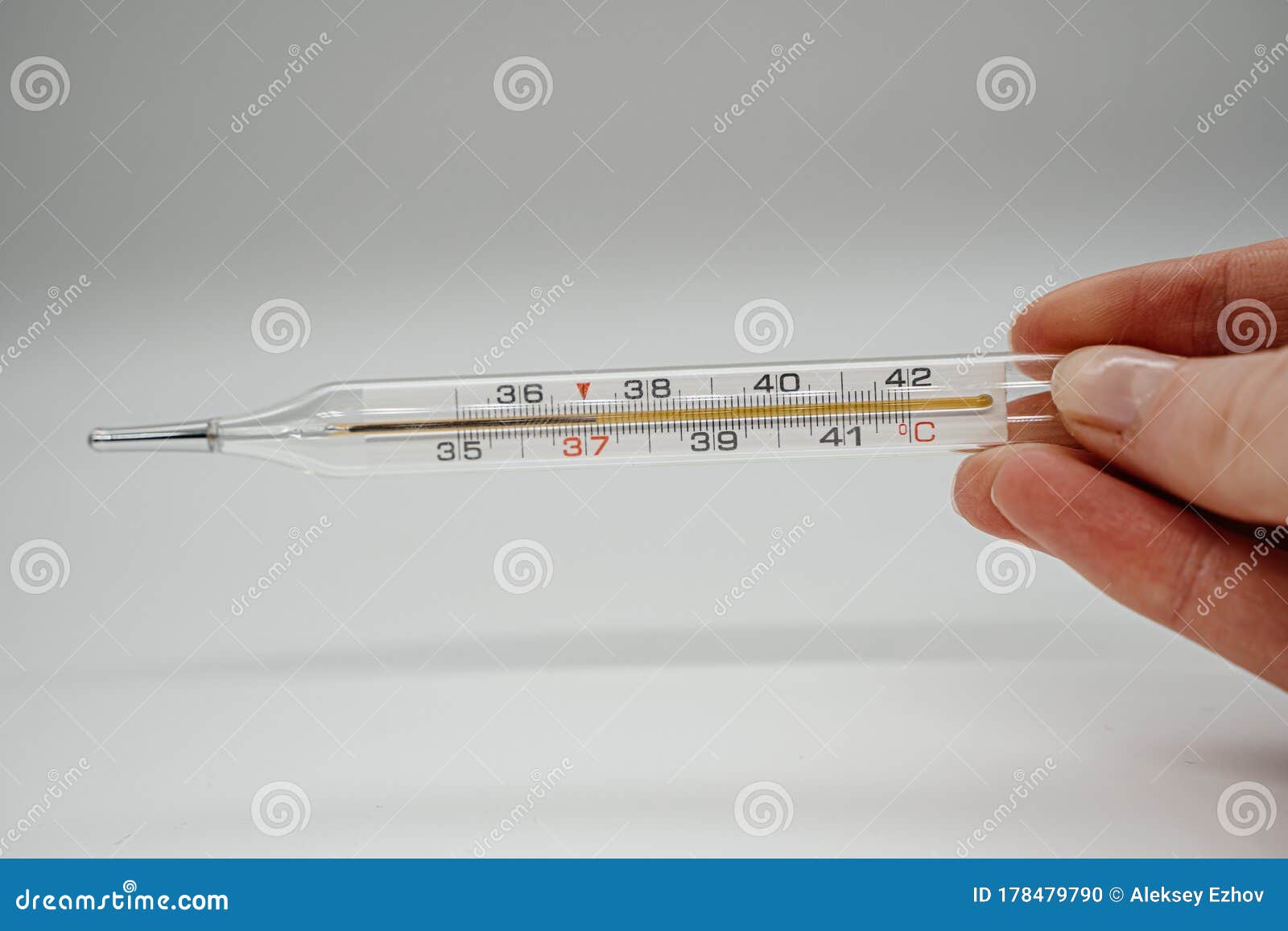Thermometer in Hand Close-up with a Temperature of 37.2 Stock Photo ...