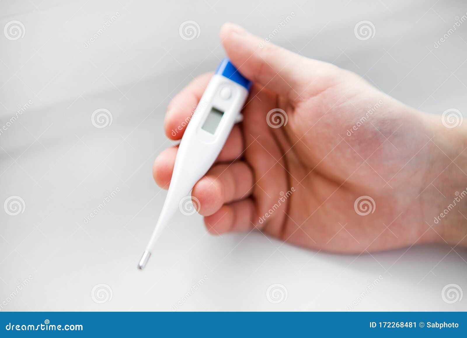 Thermometer in a Hand stock image. Image of limb, electronic - 172268481