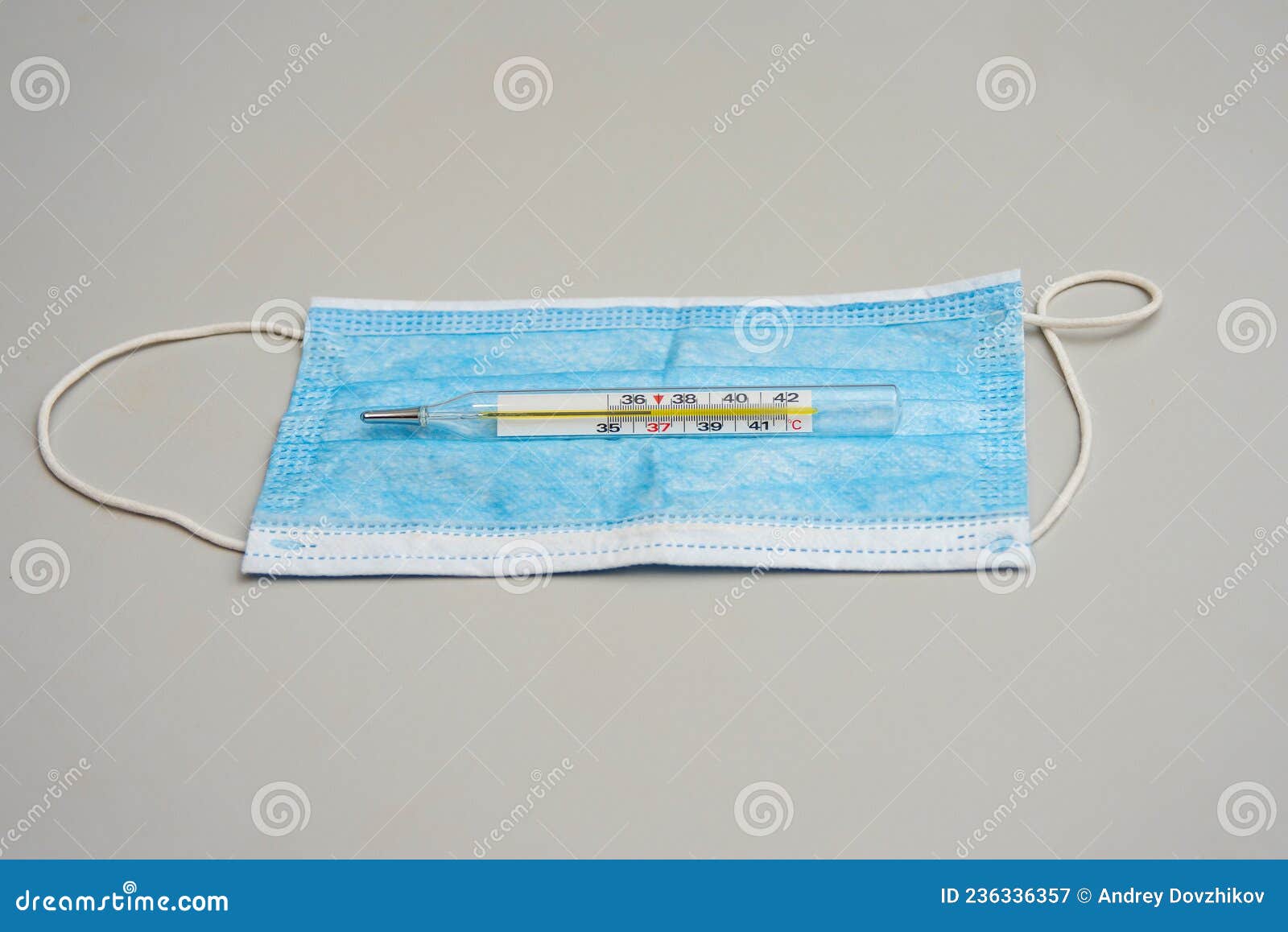 The Thermometer Lies on the Mask and Shows a Positive Temperature Stock ...