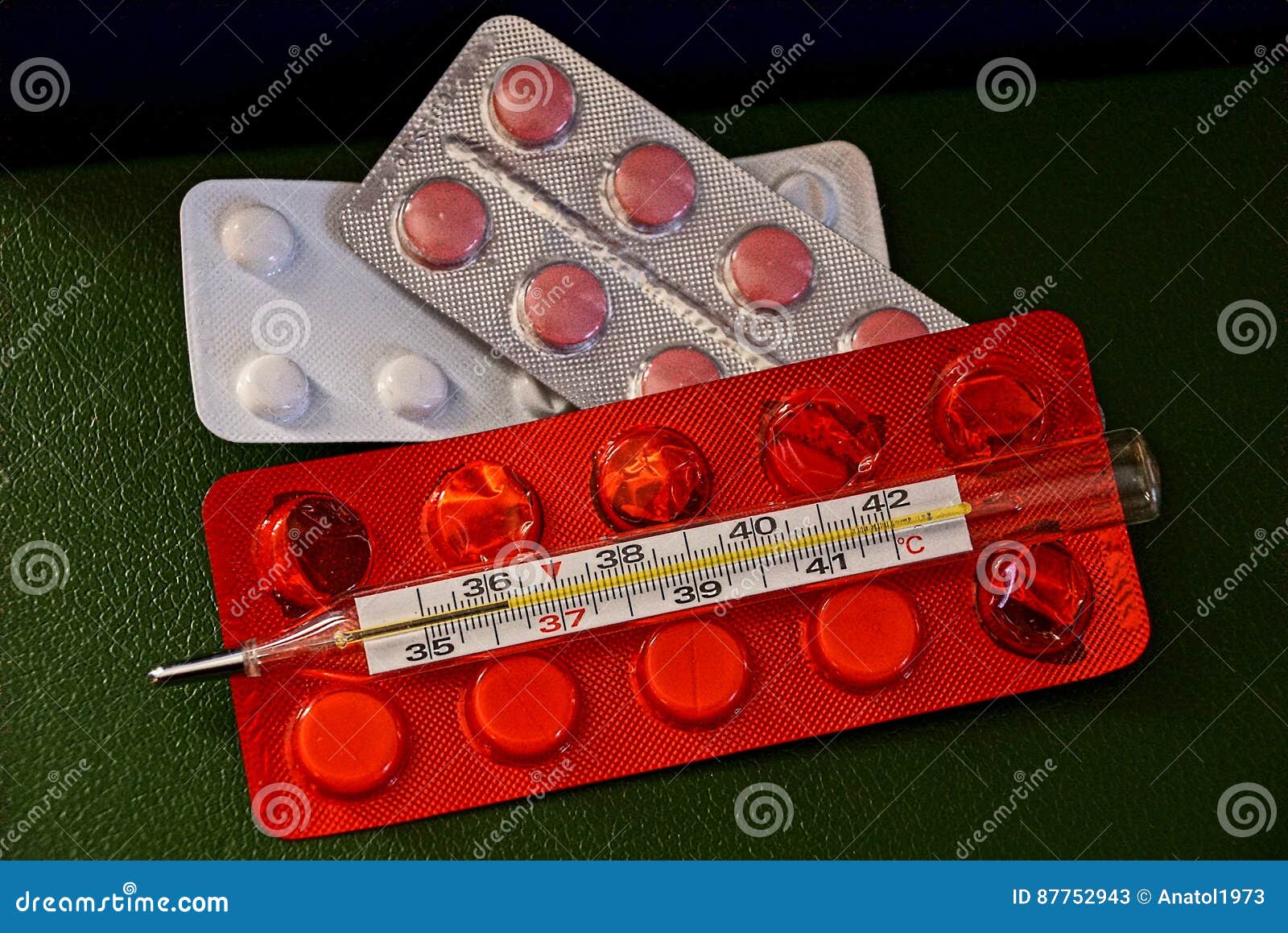 Thermometer and Pills on a Green Background Stock Image - Image of ...