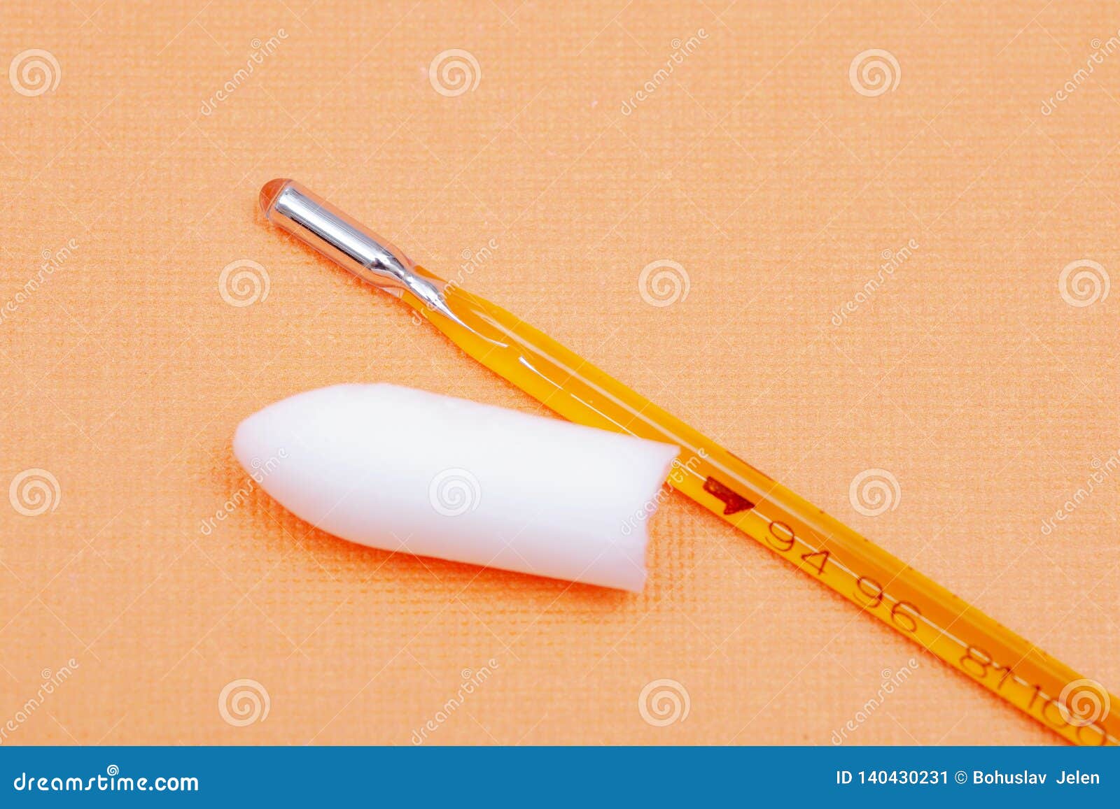 Thermometer and Suppository Medication on Orange. Rectal Drug ...