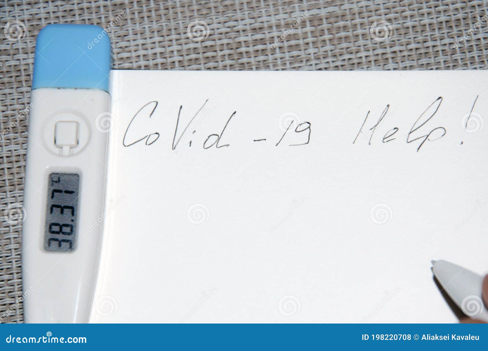 A Thermometer with Temperature Readings and a Note in the Notebook for ...