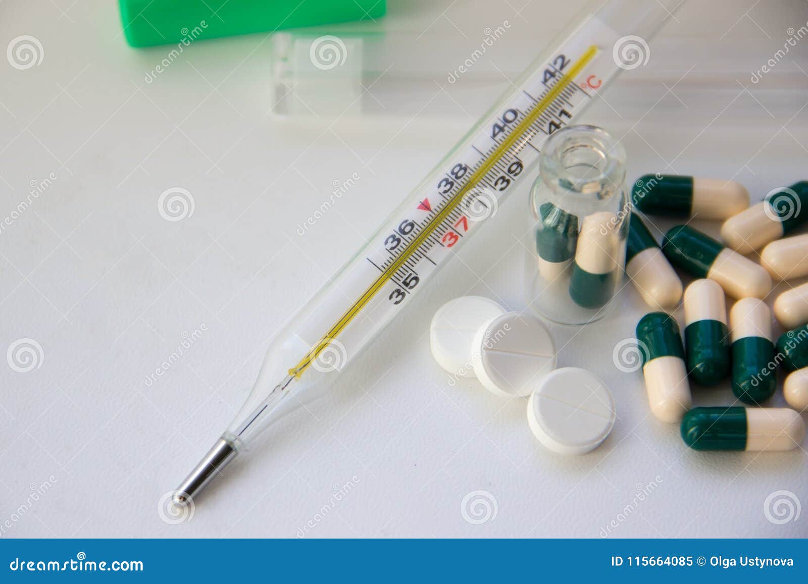 Thermometer with a Temperature of 38 and Tablets and Capsules Stock ...