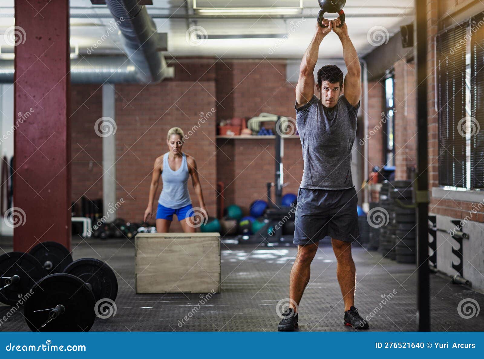 Theyre Making this Workout Count. Two People Working Out with ...