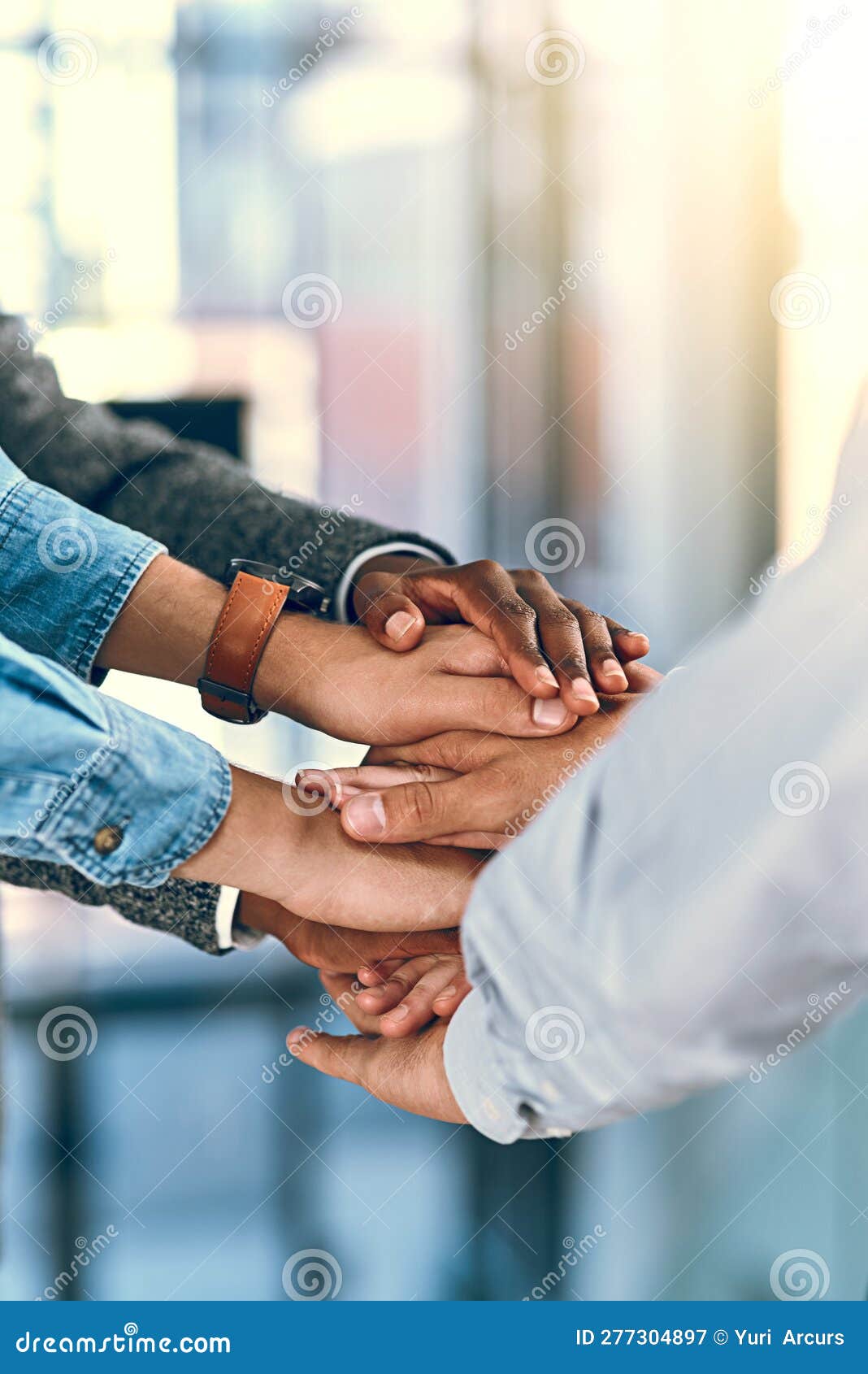 Theyre a Team. a Group of Unrecognizable Businesspeople Standing in a ... Theyre a Team. a Group of Unrecognizable Businesspeople Standing in a ...