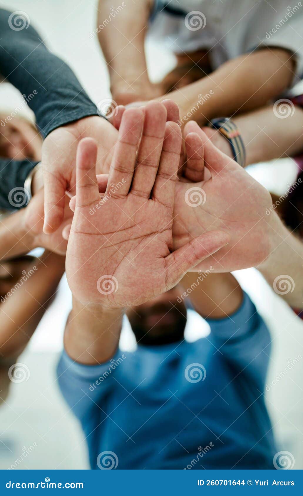 Theyre In It To Win It Low Angle Shot Of A Young Design Teams Hands In