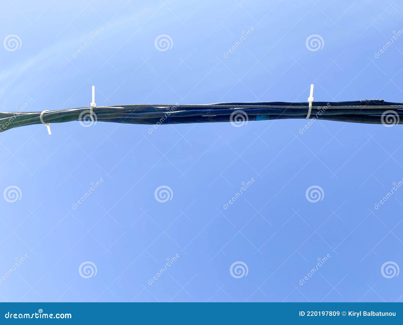 Thick Black Electrical Industrial High Voltage Wire Cable on a Blue Sky ...