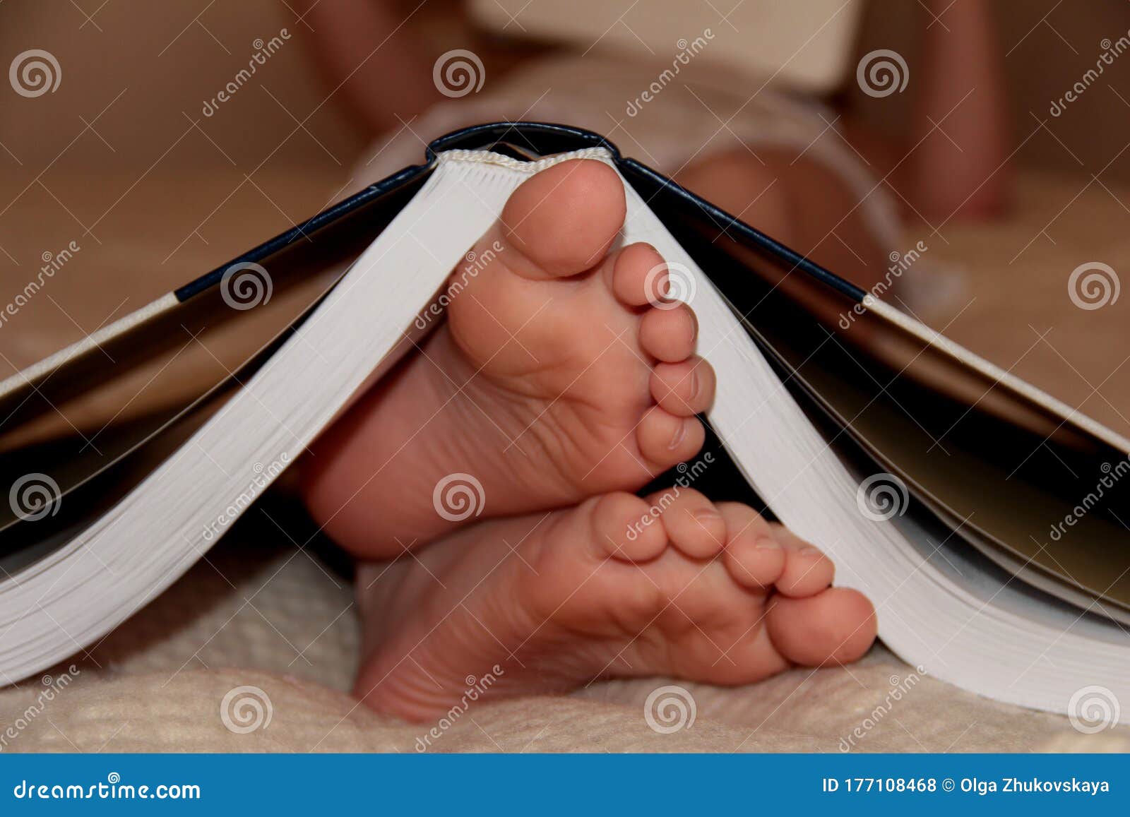 A Thick Book on the Legs of a Child Stock Photo - Image of learn ...