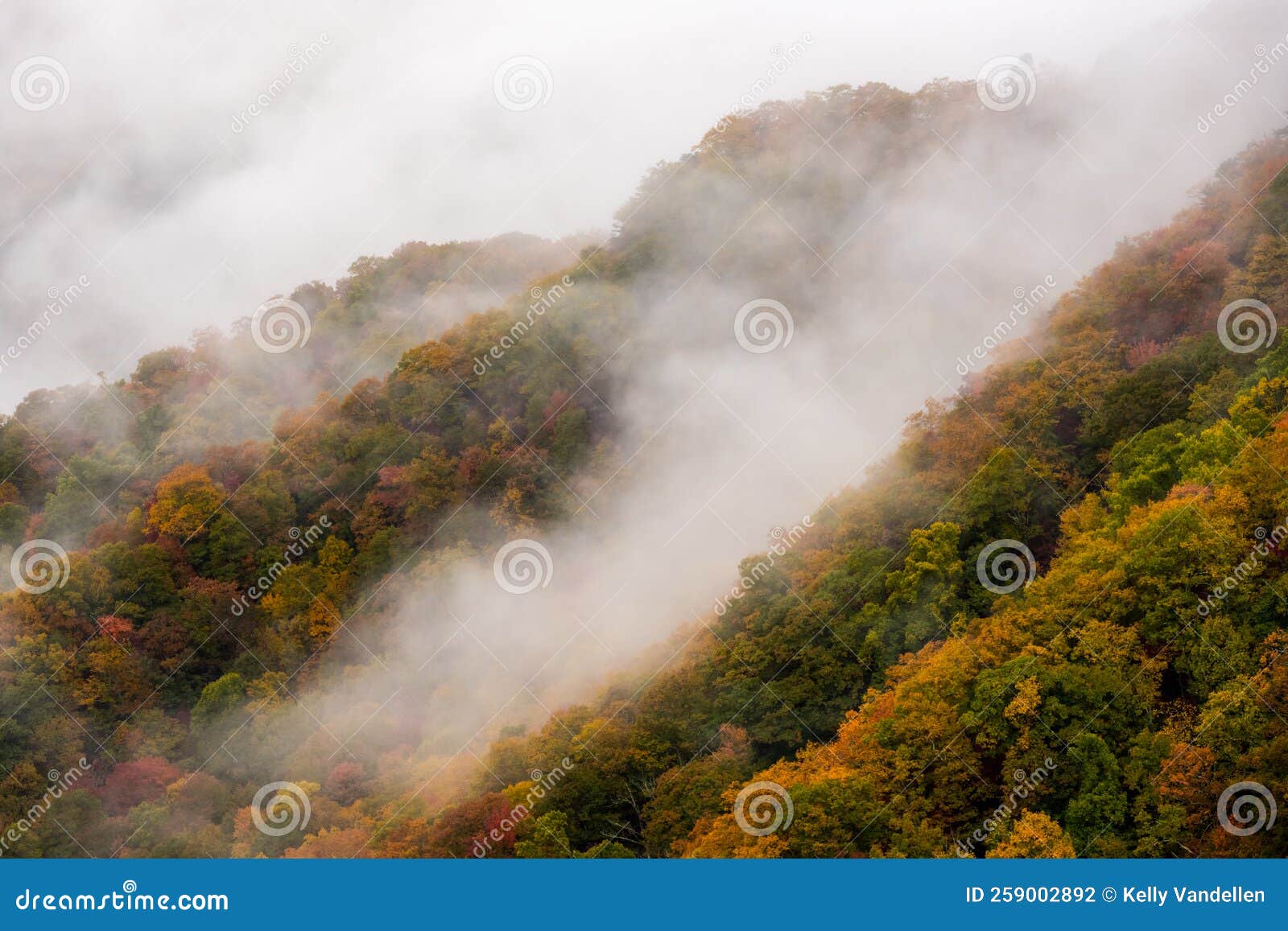 Thick Clouds Fill the Gaps between Fall Covered Ridges Stock Photo ...