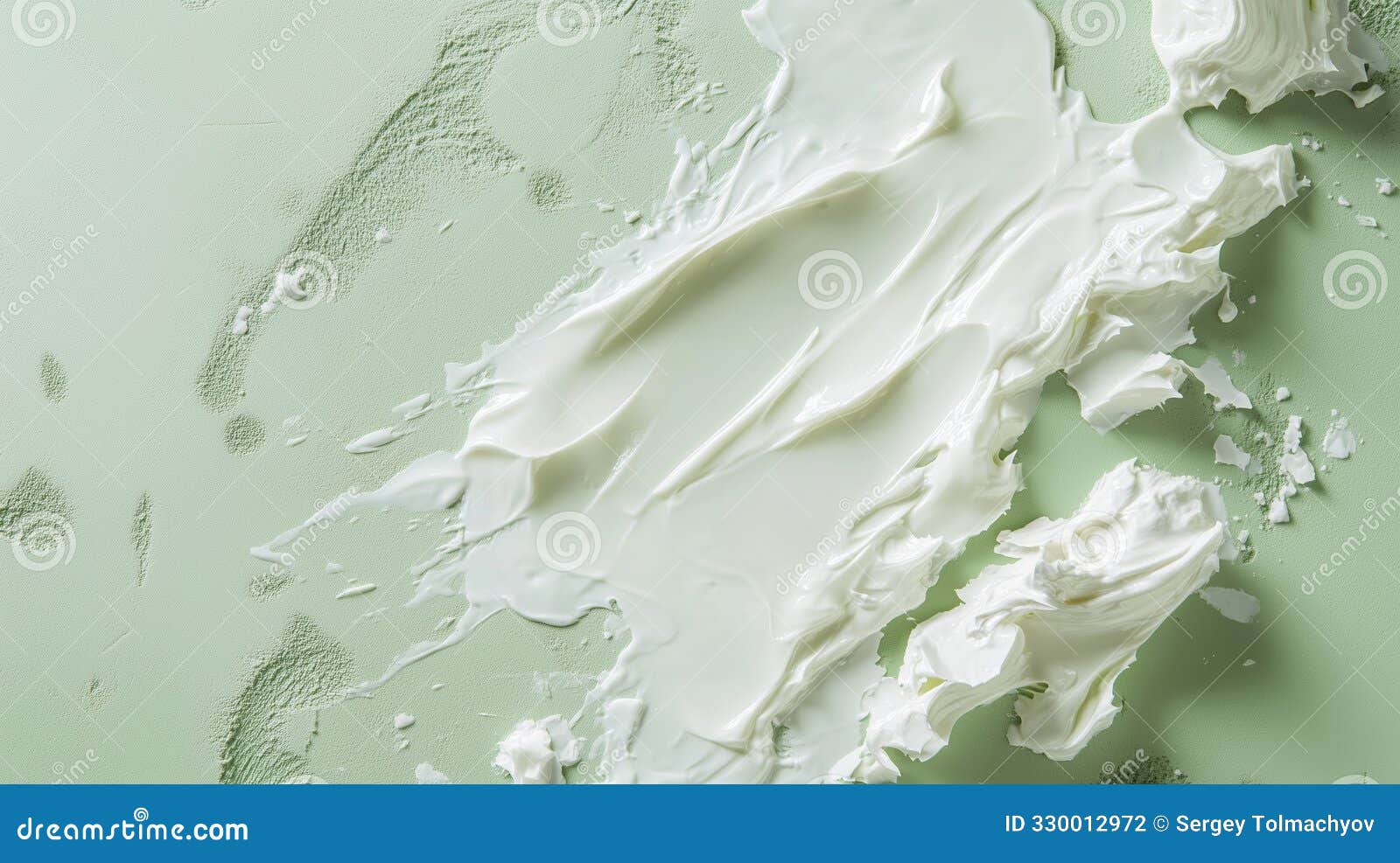 Creamy White Substance Spread Across a Light Green Surface during a ...