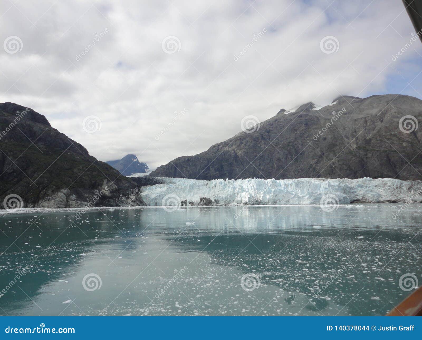 Thick Glacier between Two Mountains Slowly Gliding into the Pacific ...
