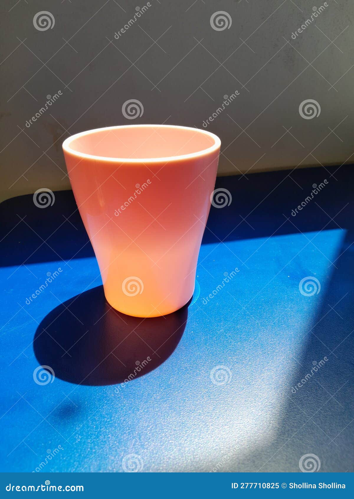A Thick Glass of Pink Placed in the Searing Sun Stock Image - Image of ...