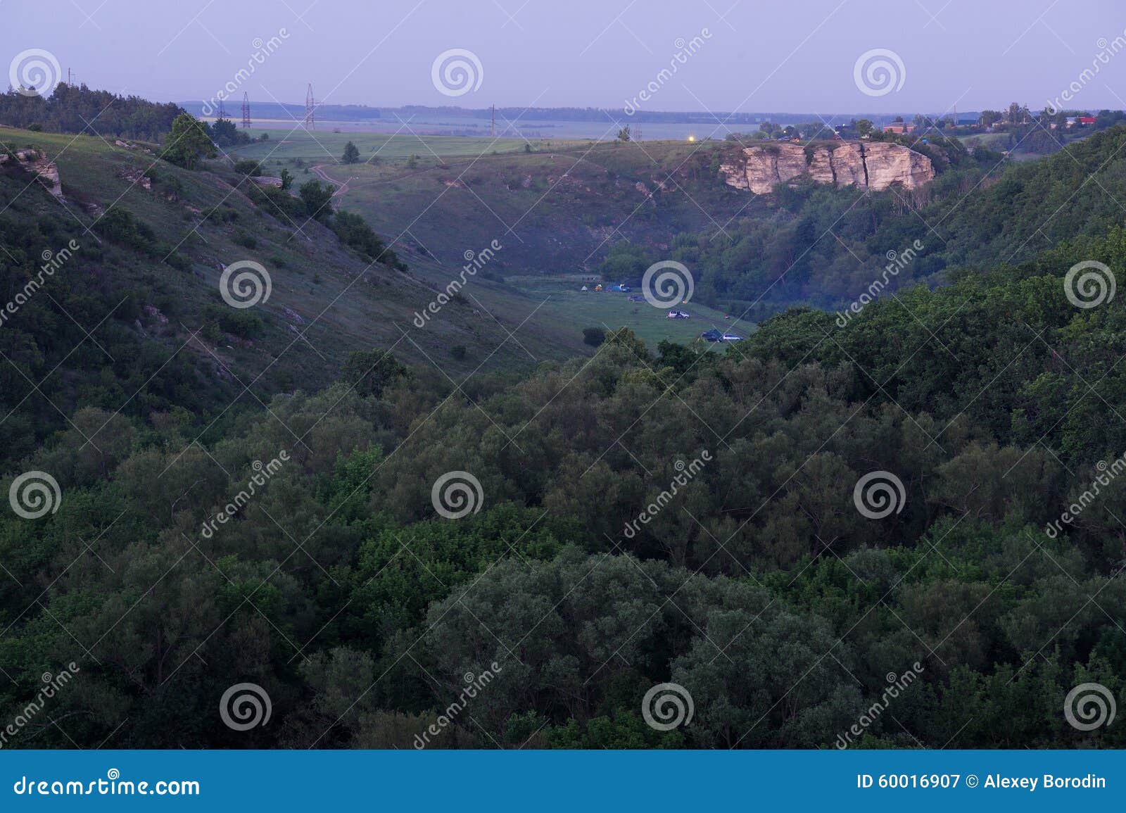 Thick Green Forest with Distant Rocks in Summer Sunset Stock Image ...