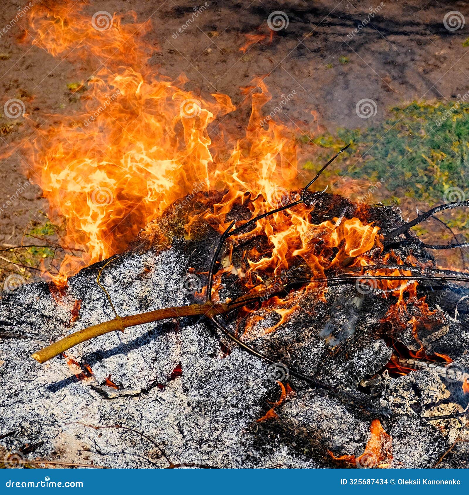 Thick Grey Smoke is Rising into the Air from the Source of the Flame ...