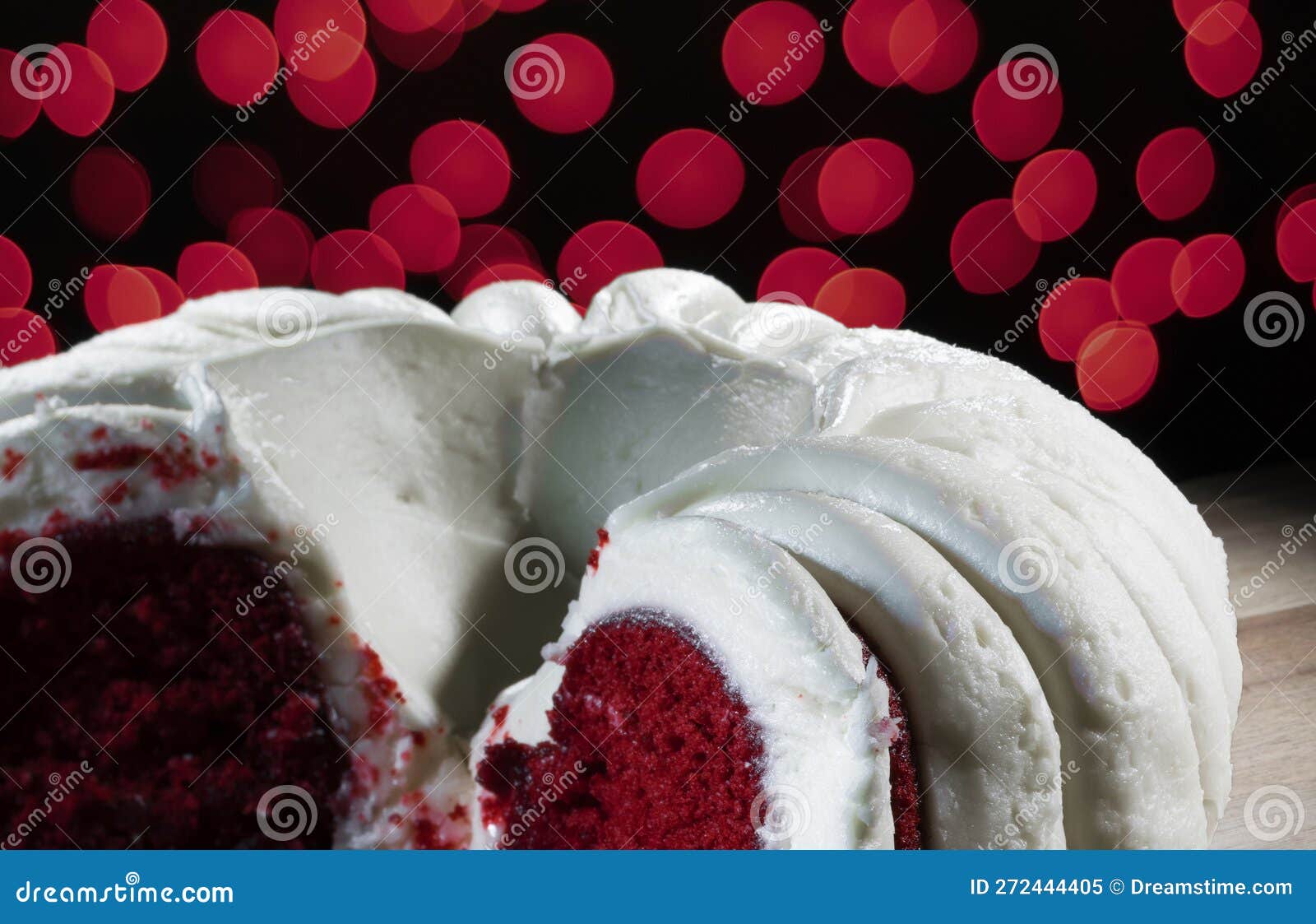 Thick Icing on a Red Velvet Cake with Party Lights Stock Image - Image ...