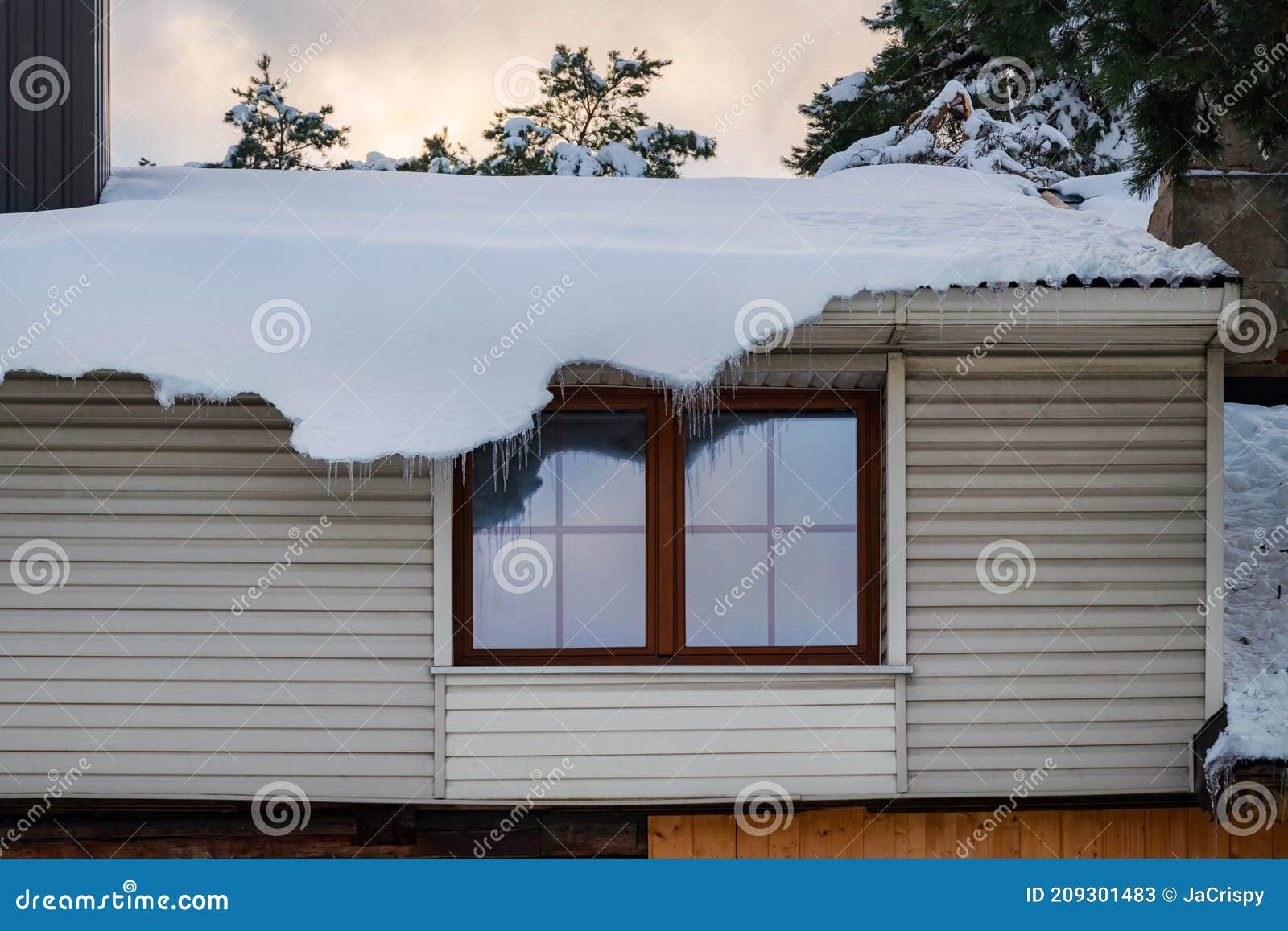 Thick Layer of Snow Hanging Off the Edge of the Roof Stock Image ...
