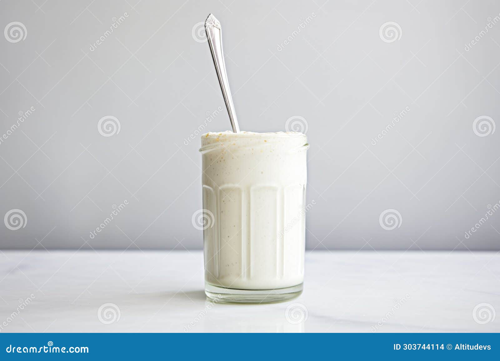 Thick Milkshake with a Spoon Standing Upright, Creamy Texture Stock ...