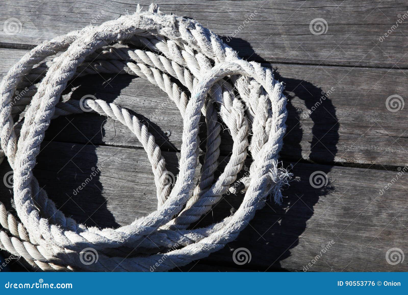 Thick rope on a boardwalk stock photo. Image of detail - 90553776