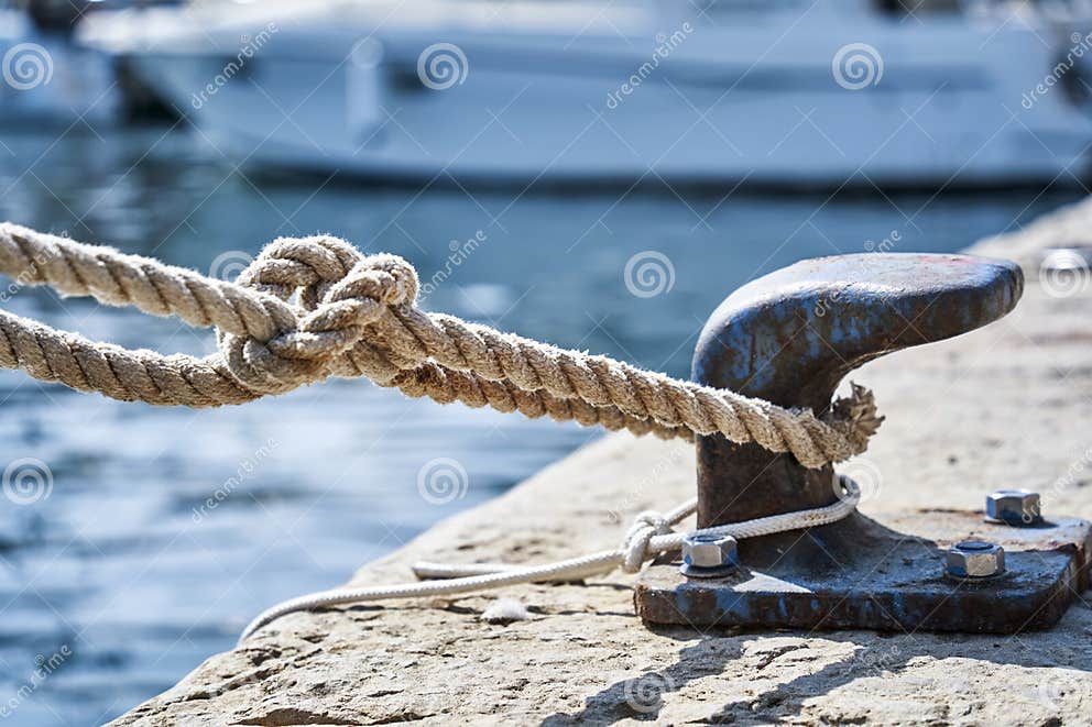 Thick Rope Securely Fastened To a Berth on the Pier, Concept for Secure ...