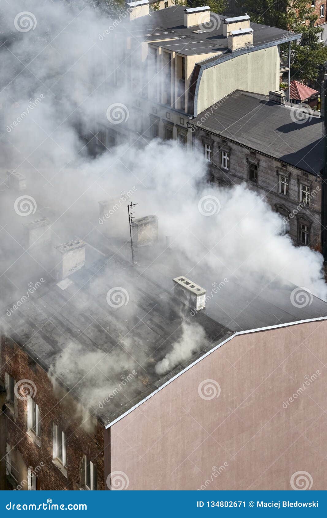 Thick Smoke Coming from the Roof of a Building on Fire Stock Image ...