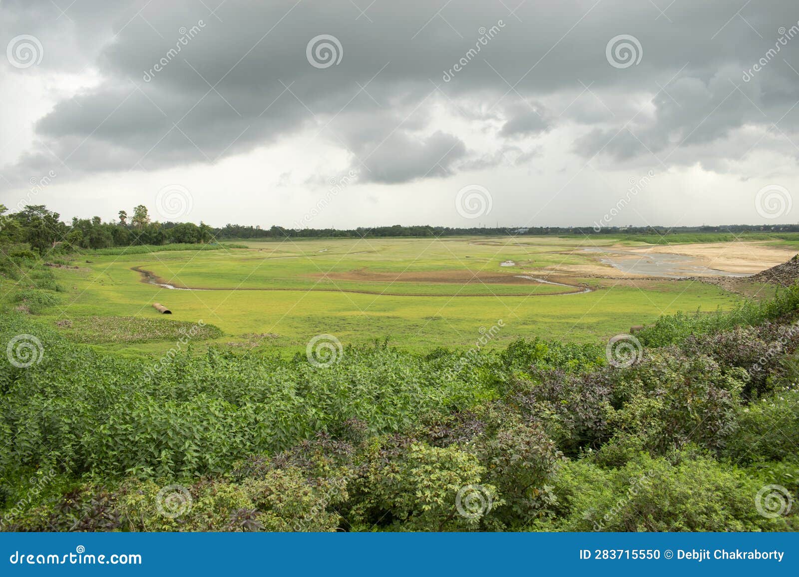 Thickets with Grassy Meadow and Distant River Gorge Under the Dramatic ...