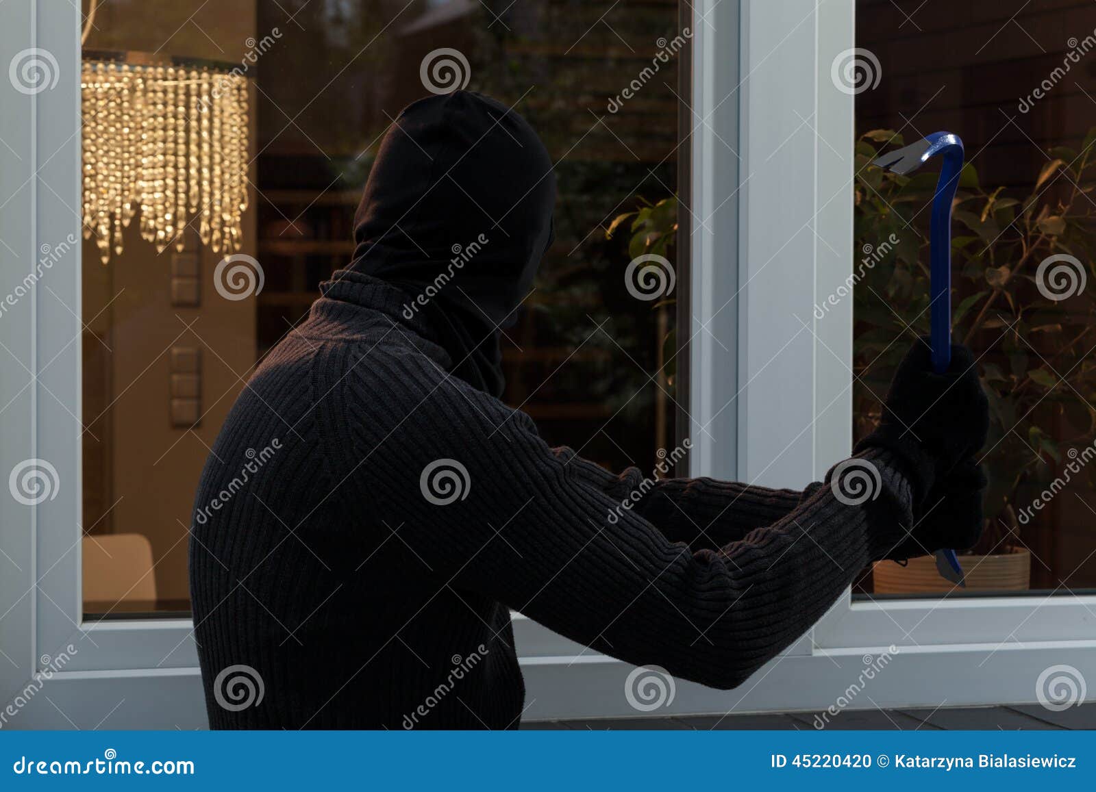 Thief breaks the glass stock photo. Image of face, robbery - 45220420
