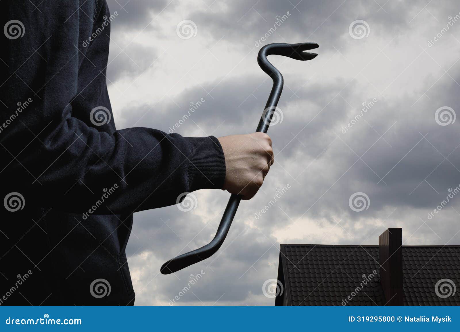 A Thief with a Crowbar in Front of a Sky and the Roof of a House Stock ...