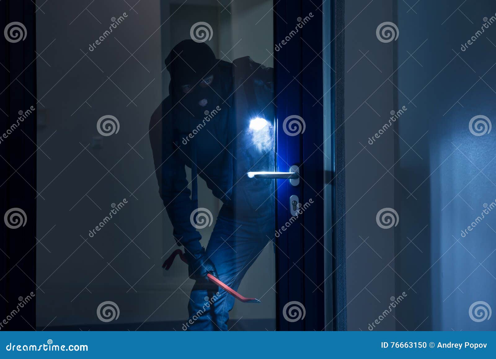 Thief with Flashlight Trying To Break Door Stock Photo - Image of ...