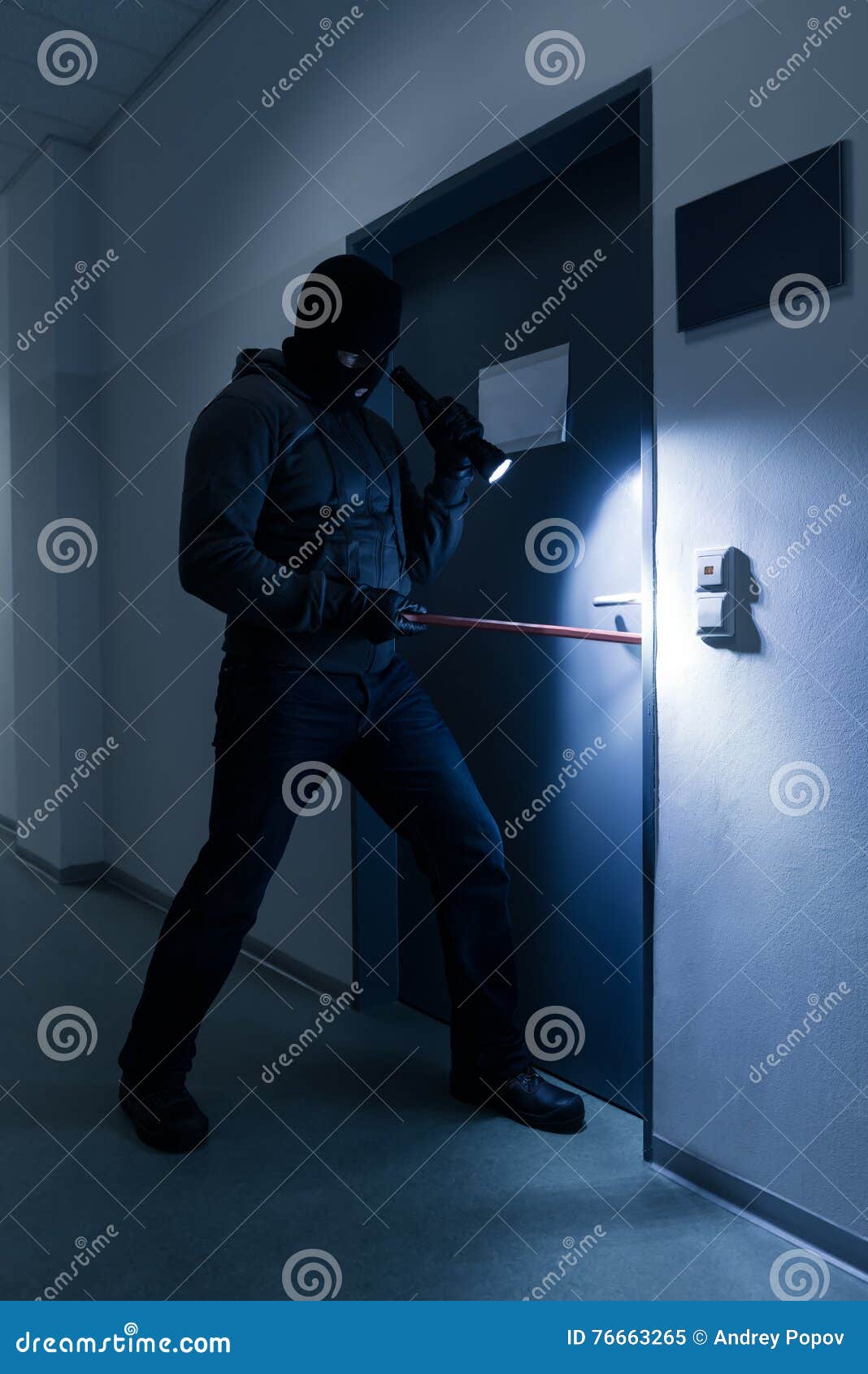Thief with Flashlight Trying To Break Office Door Stock Image - Image ...